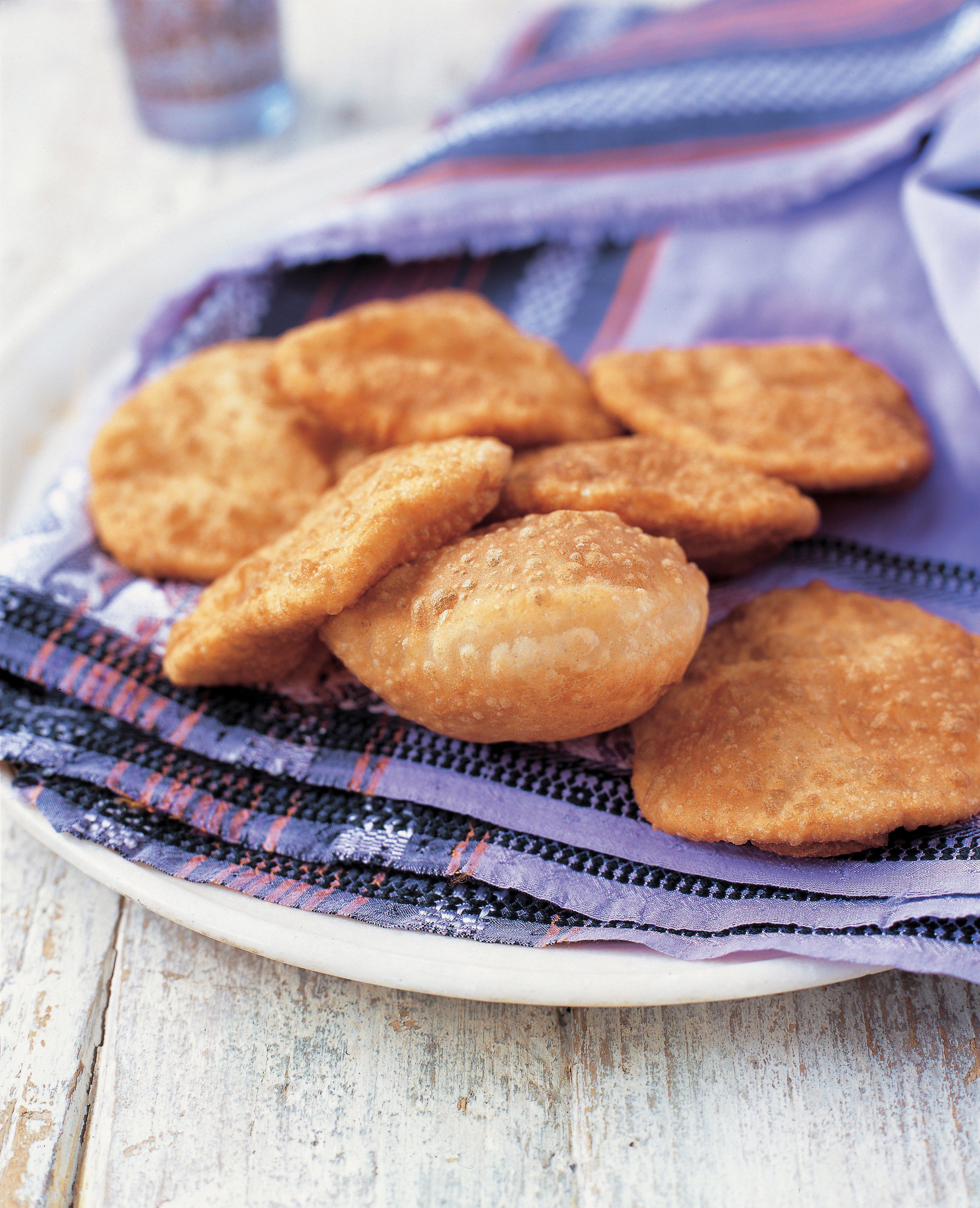 Deep-fried soft puffed bread from The Complete Indian Regional Cookbook ...