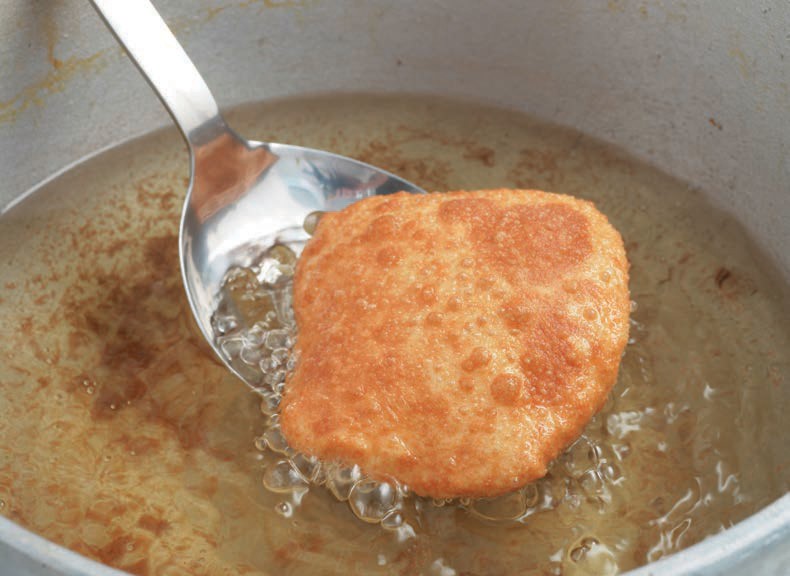 Deep-fried soft puffed bread from The Complete Indian Regional Cookbook ...